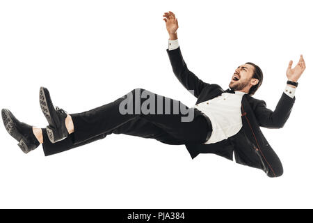 The frightened businessman in suit falling down and screaming against ...