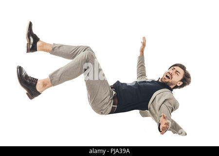 The frightened businessman in suit falling down and screaming against ...
