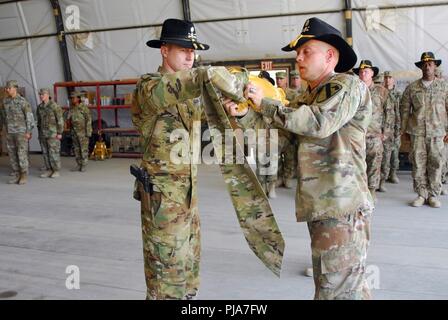 U.S. Army Lt. Col. Brandon H. Ungetheim (left), outgoing commander and ...