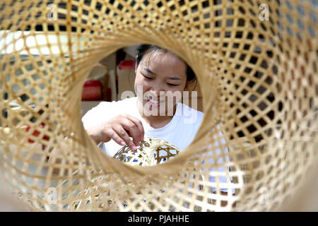 Meishan, China. 6th Sep, 2018. Workers make bamboo lanterns at a ...