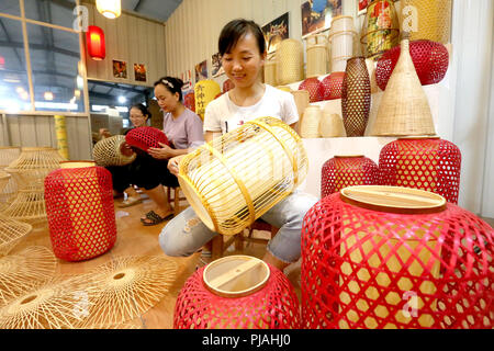 Meishan, China. 6th Sep, 2018. Workers make bamboo lanterns at a ...