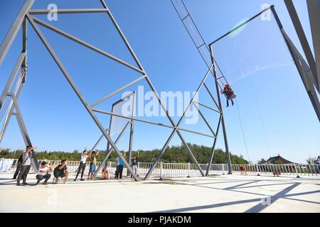 Xinmi, Xinmi, China. 6th Sep, 2018. Xinmi, CHINA-A swing can be seen on ...