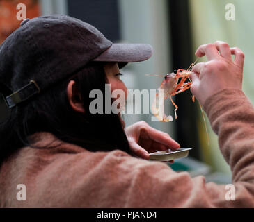 Toyko, Japan - June 6, 2017: A woman about to enjoy some fresh seafood ...