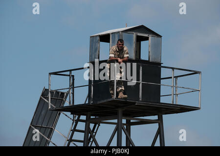 A Lebanese soldier stands outside a watchtower at the Lebanese side of ...