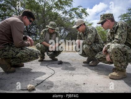 US Navy EOD personnel conduct checks on their equipment before ...