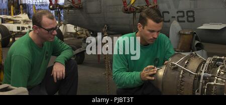 Aviation Machinist Mate Second Class (AD2) and AD3 Karpinski and a ...