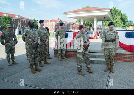 Colonel Mark Hoffmeister presents LTC Estee Pinchasin with the ...