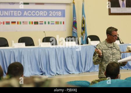 Army Staff Sgt. Bart Thomassen, an interpreter (right), translates for ...
