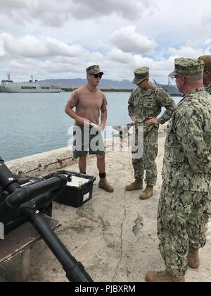 A U.S. Navy Seabee, assigned to Underwater Construction Team (UCT) 2 ...