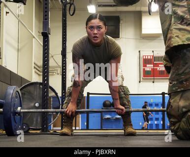 Spc. Diane Hoang from the U.S. Army Training Center zeros her weapon ...