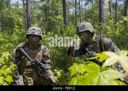 U.S. Marine Corps Sgt. Ian Gomez, right, an imagery intelligence chief ...