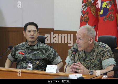 Republic of Korea Marine Corps (ROKMC) Sgt. Maj. Hee Joong Cho, left ...