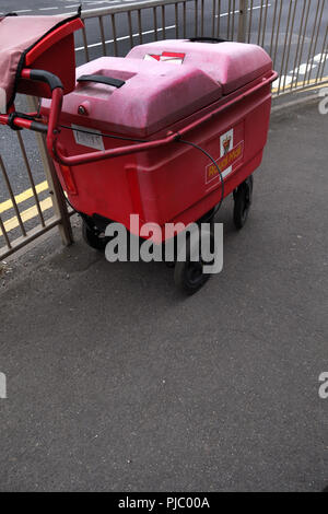 Electric mail delivery cart or trolley with Posti logo and brand color ...