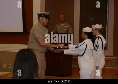 Master Chief James Baker receives a gift from Chief Randolph Waldburg ...