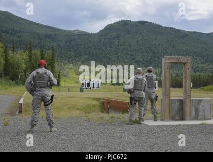 US Navy Combat Systems personnel download a RIM-7 Sea Sparrow missile ...