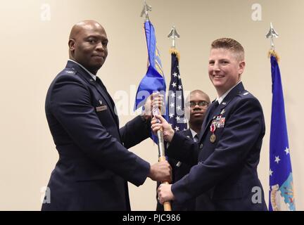 The ceremonial passing of the guidon from the outgoing commander to the ...