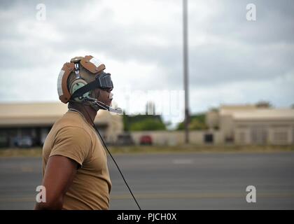 US Navy Plane Captain Airman right, instructs his trainee, Airman how ...