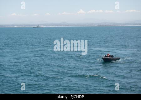Royal Canadian Navy sailors crane a Meggitt Hammerhead drone into the ...