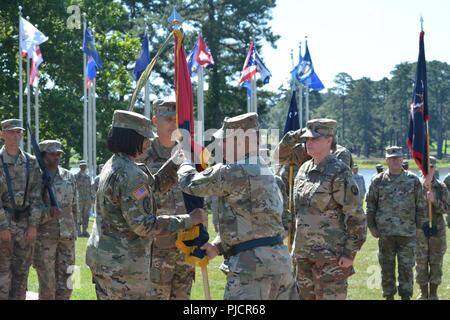 Col. Karen Monday-Gresham, incoming 4th Brigade commander (right) holds ...