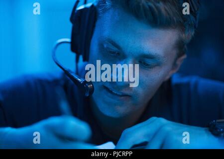 US Navy Mineman 3rd Class prepares to operate the mine neutralization ...