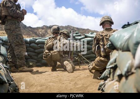US Marine prepare to fire an M224 60mm mortar system during an ...
