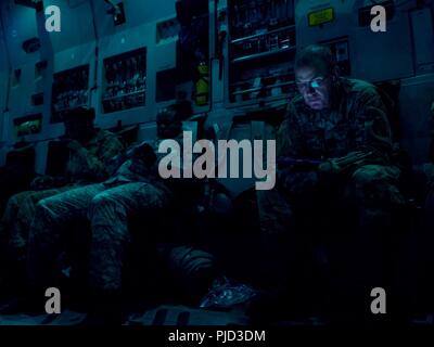 U.S. Army Alaska Command Sergeant Major Michael Ferrusi hoists the ...