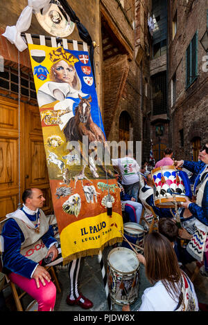 Members Of The Victorious Istrice Contrada Take A Rest As They Parade ...
