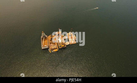 marine dredging digging sea bottom black mud in marina Stock Photo - Alamy