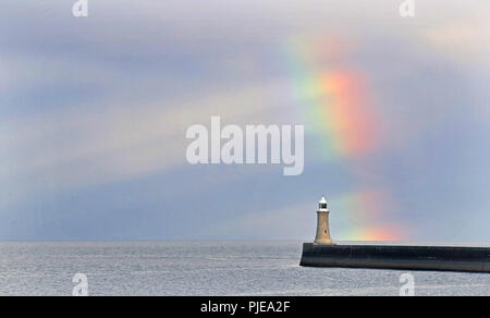 A rainbow over Tynemouth lighthouse in Northumberland Stock Photo - Alamy