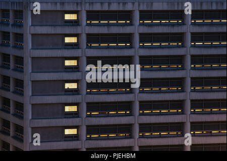 Downtown Seattle courthouse jail exterior with rows of light at sunset ...
