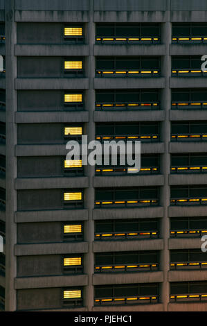 Downtown Seattle courthouse jail exterior with rows of light at sunset ...