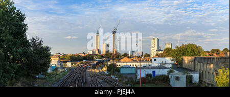 Changing skyline of Woking, Surrey: railway tracks lead to tower cranes ...
