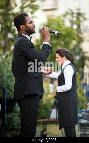 Jazz singer at gala concert. Vitebsk symphonic orchestra at open-air ...
