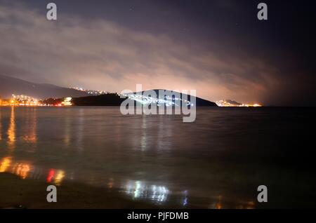 Holiday resort by night in Kusadasi, Turkey. Aegean Sea and beach in ...