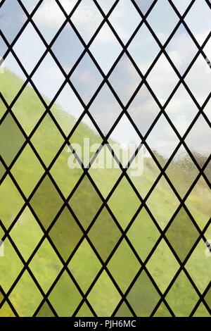 The diamond shaped pattern of a stained glass window UK Stock Photo - Alamy