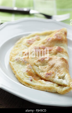 Ham folded on white plate close up Stock Photo - Alamy