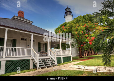 Key West Lighthouse with a Poinciana tree out front overlooks Old Town ...