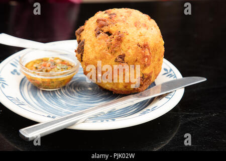 Ecuadorian bolon de verde or green plantain dumplings stuffed with ...
