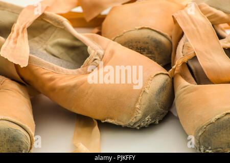 A bunch of old used ballet shoes isolated on white background Stock ...