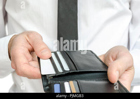 Man taking credit card from wallet in bedroom, closeup Stock Photo - Alamy
