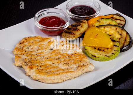 Tasty grilled chicken stake and vegetables Stock Photo - Alamy