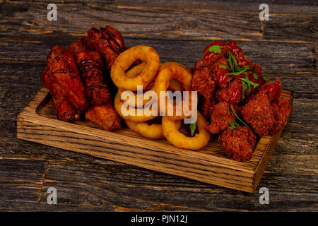 Chicken wings, leg and onion fry plate Stock Photo - Alamy