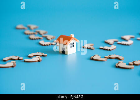 The concept of returning home. Footprints lead to the house Stock Photo ...