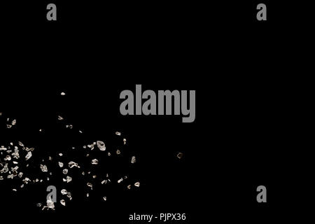 Split debris of stone exploding against black background Stock Photo ...