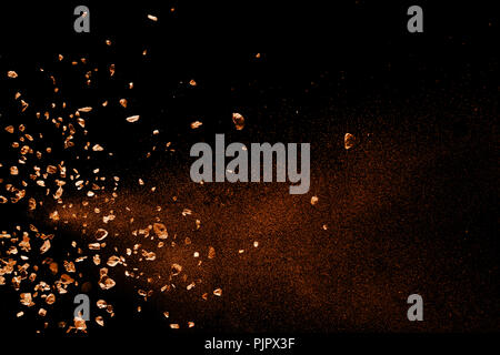 Split debris of stone exploding against black background Stock Photo ...