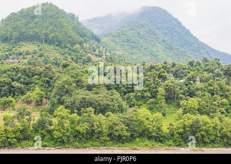 Scenery of beautiful Nepali rural village with mountains and green ...