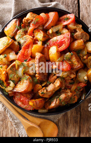 Georgian traditional recipe ojahuri with pork and potatoes close-up on ...