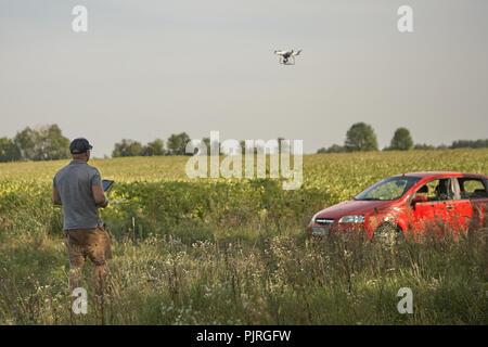 Man manages quadrocopters. Remote control for the drone in the hands of ...