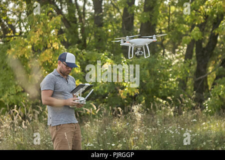 Man manages quadrocopters. Remote control for the drone in the hands of ...