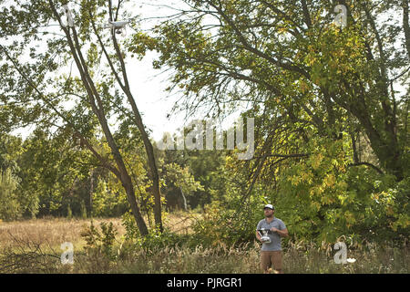 Man manages quadrocopters. Remote control for the drone in the hands of ...